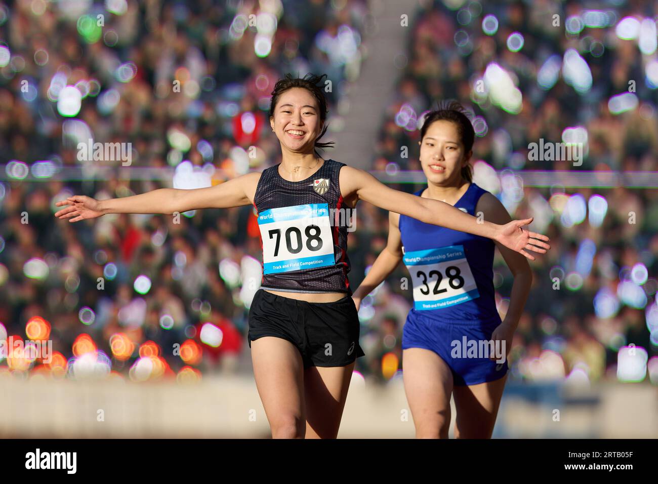 Japanese athletes running on track Stock Photo - Alamy