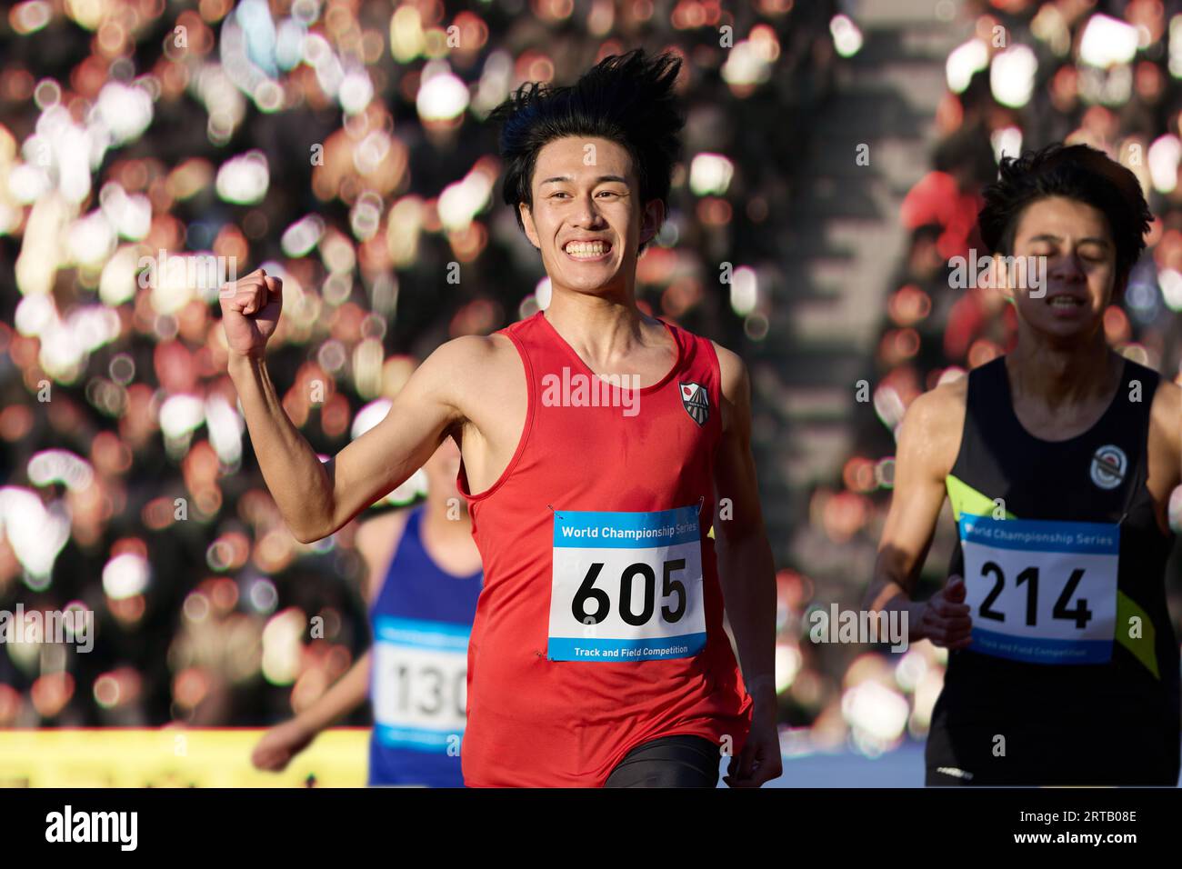 Japanese athletes running on track Stock Photo - Alamy