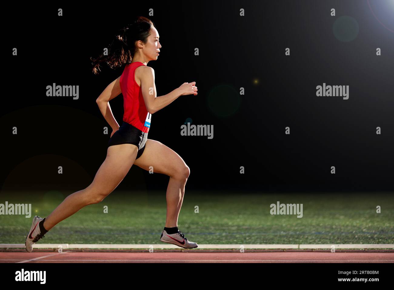 Japanese athlete running on track Stock Photo - Alamy