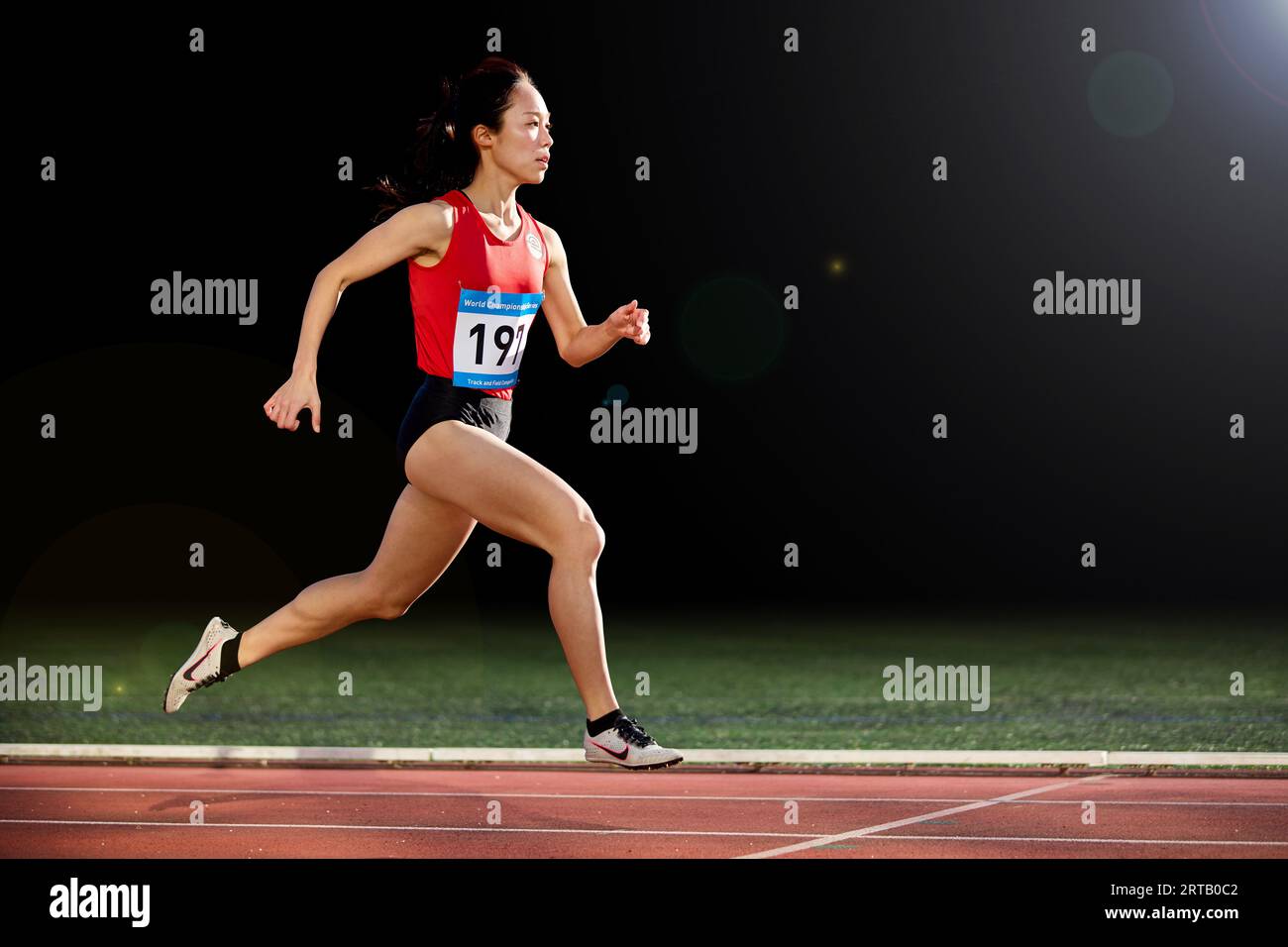 Japanese athlete running on track Stock Photo - Alamy