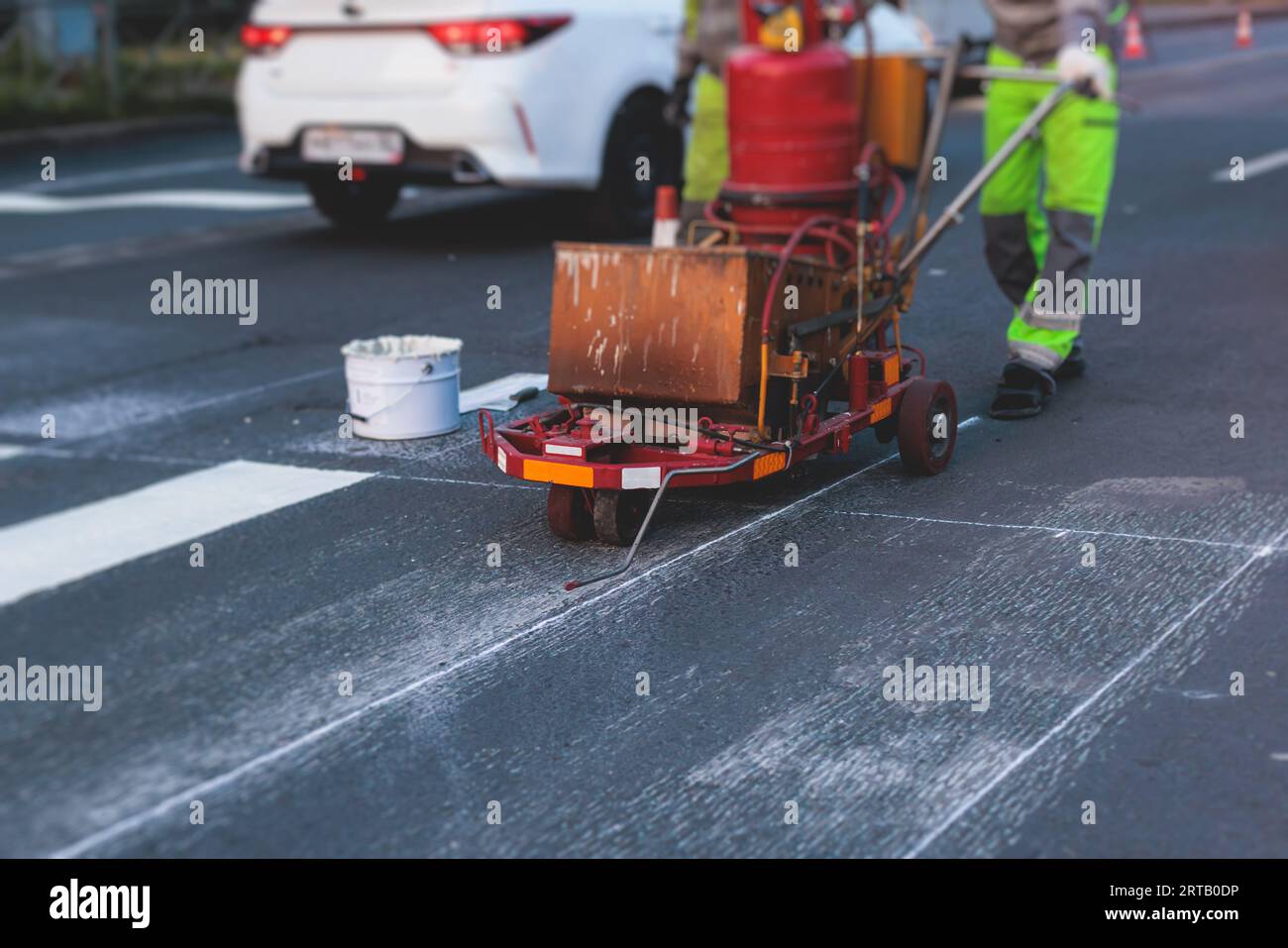 Process of making new road surface markings with a line striping ...