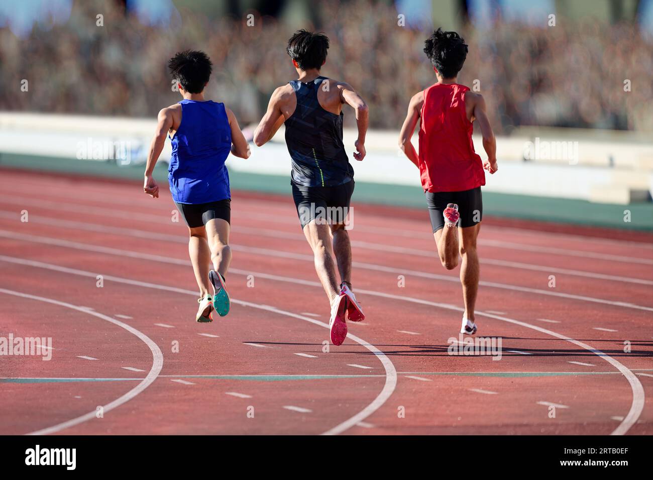 Japanese athletes running on track Stock Photo - Alamy