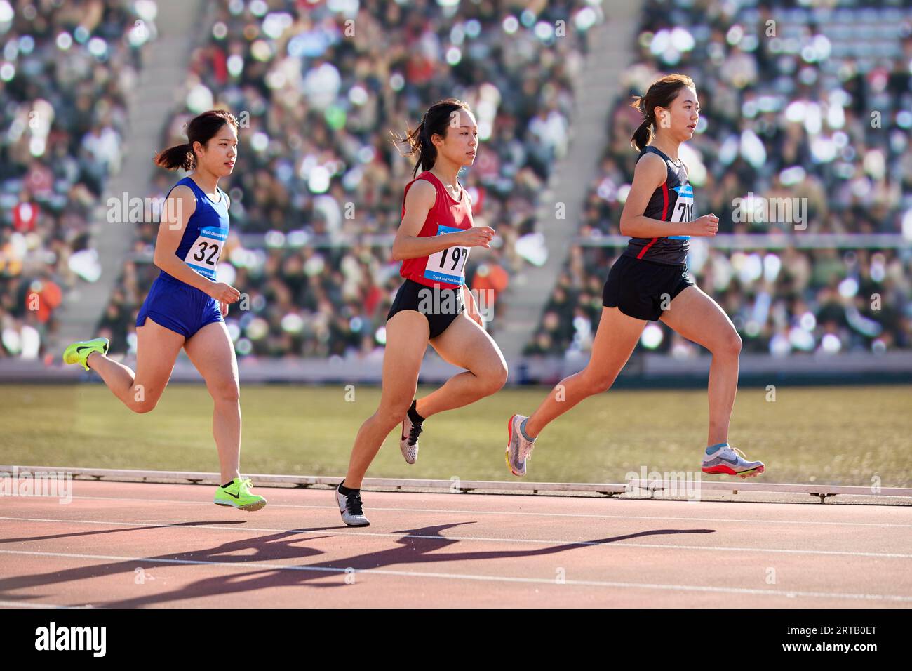 Japanese athletes running on track Stock Photo - Alamy
