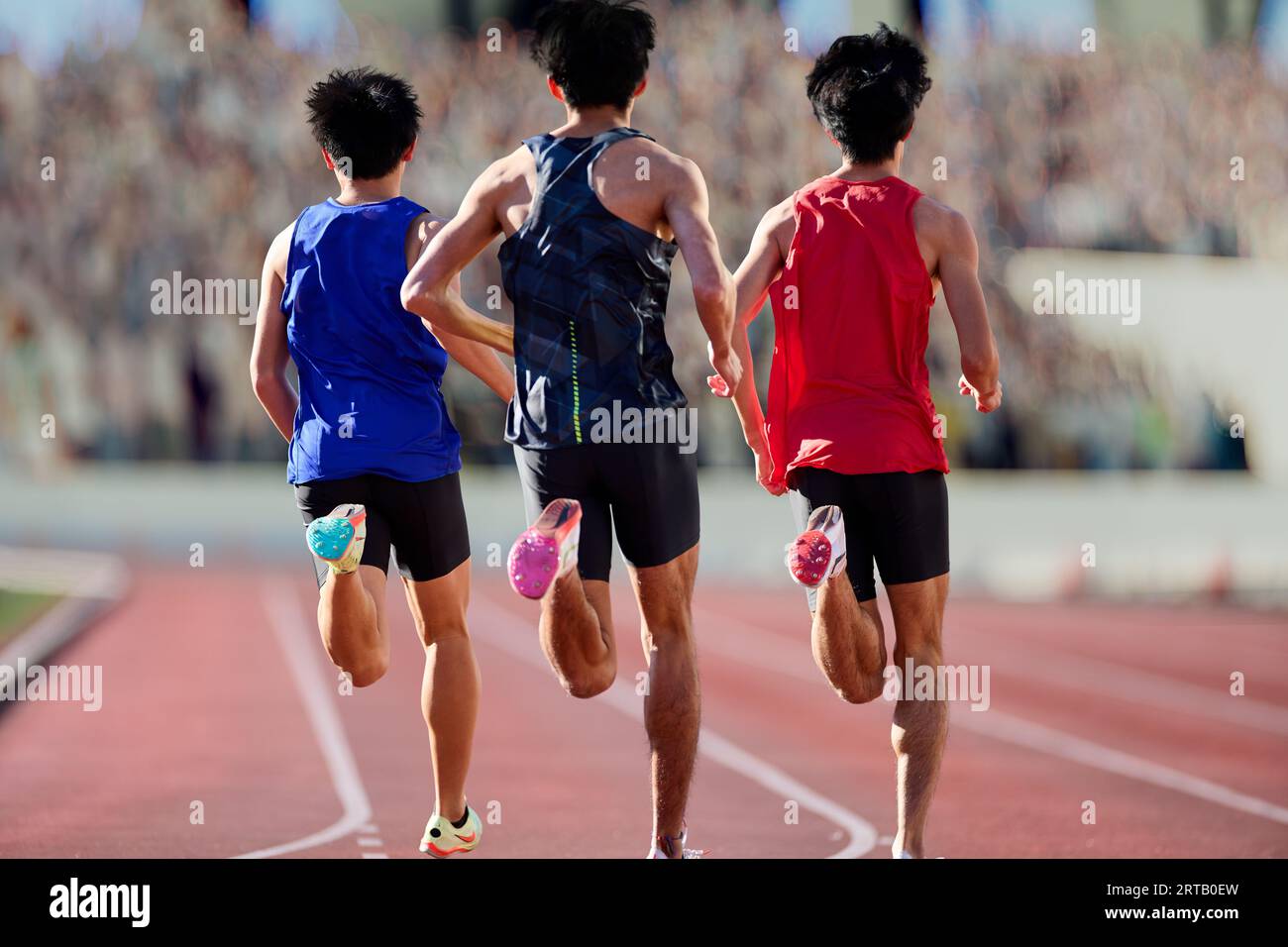 Japanese athletes running on track Stock Photo - Alamy