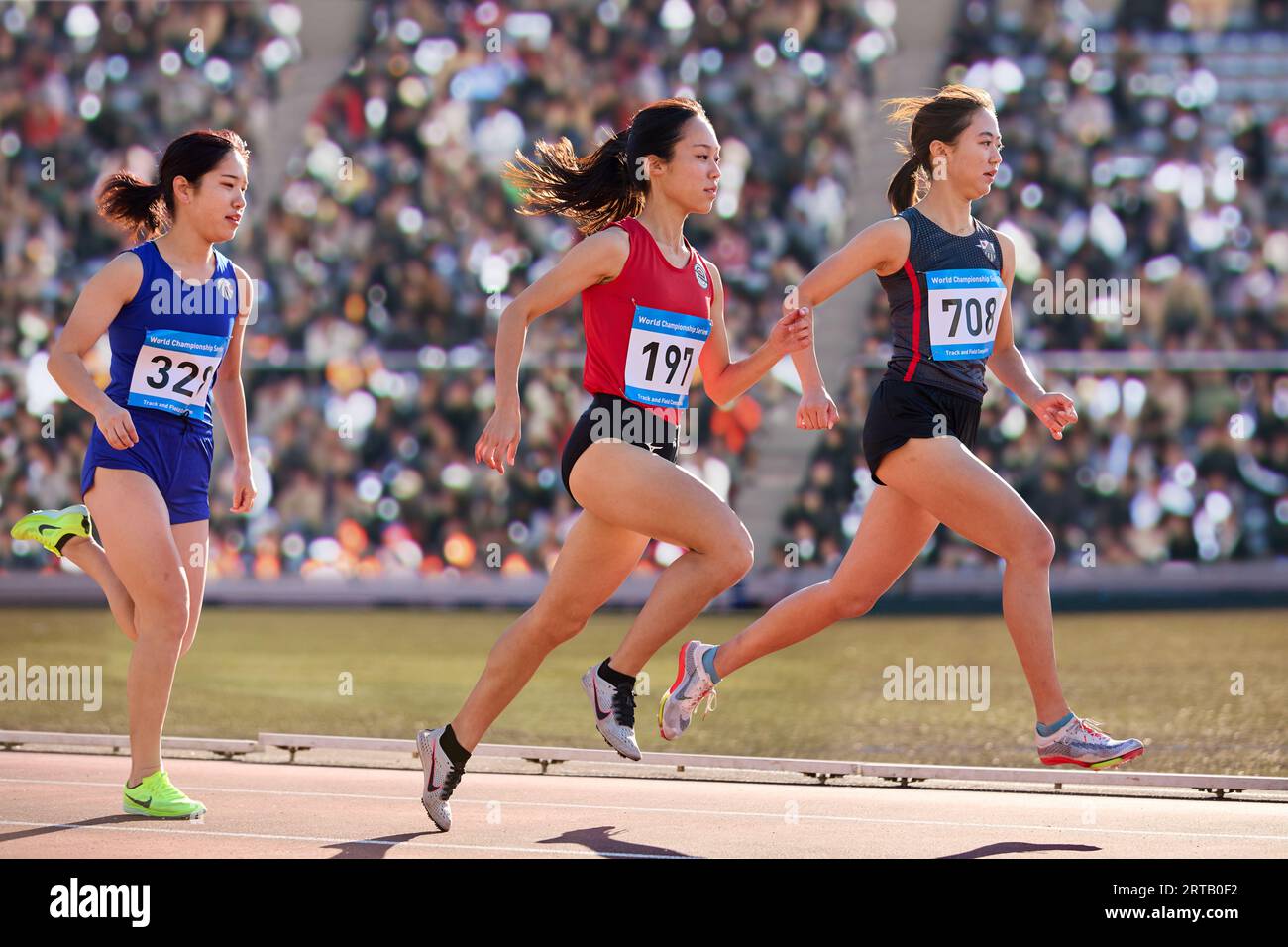 Japanese athletes running on track Stock Photo - Alamy