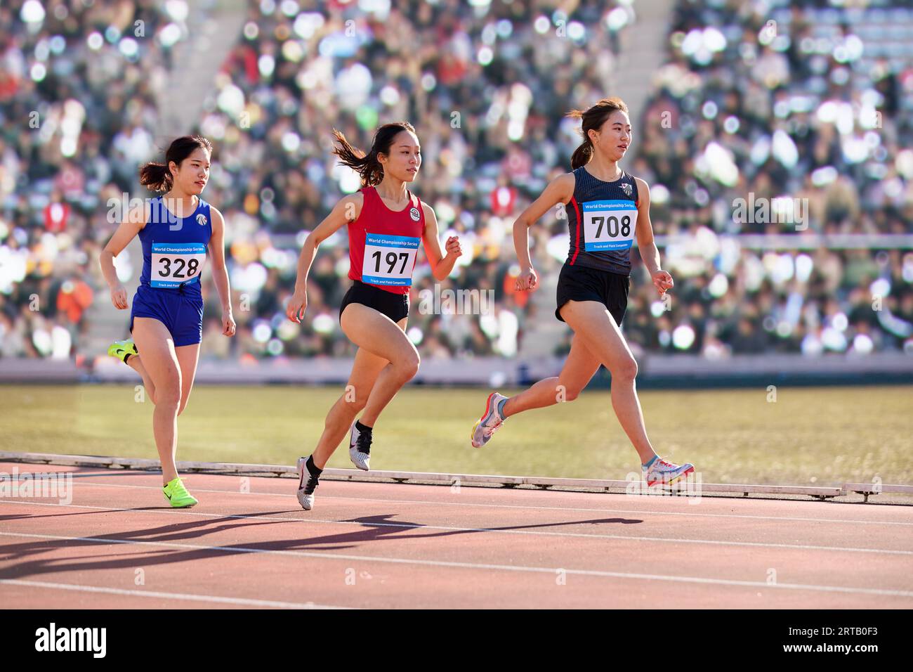 Japanese athletes running on track Stock Photo - Alamy