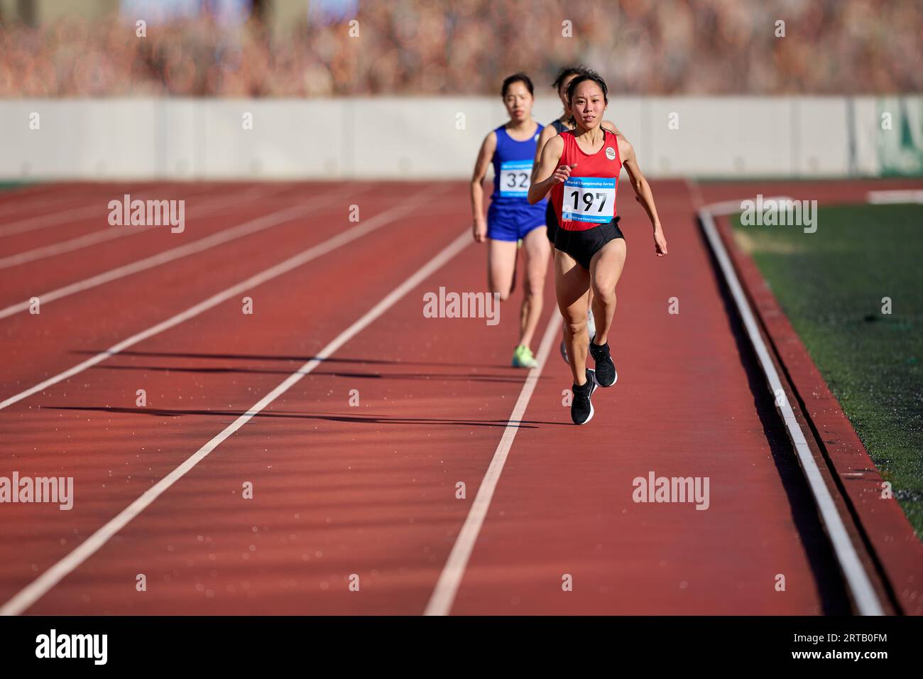 Japanese athletes running on track Stock Photo - Alamy