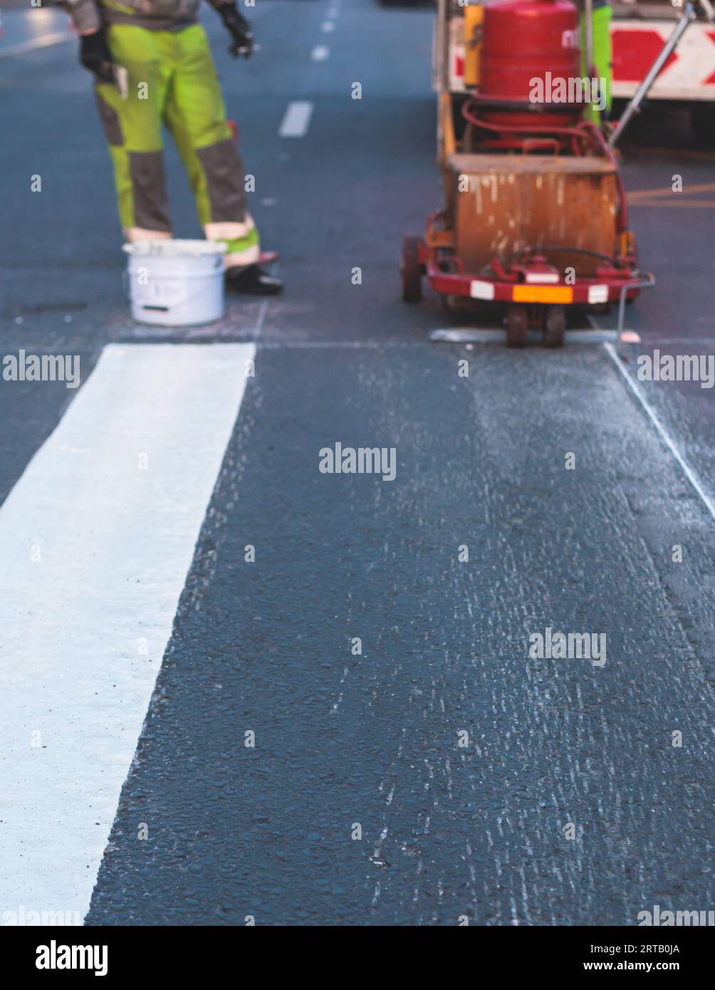 Process of making new road surface markings with a line striping ...