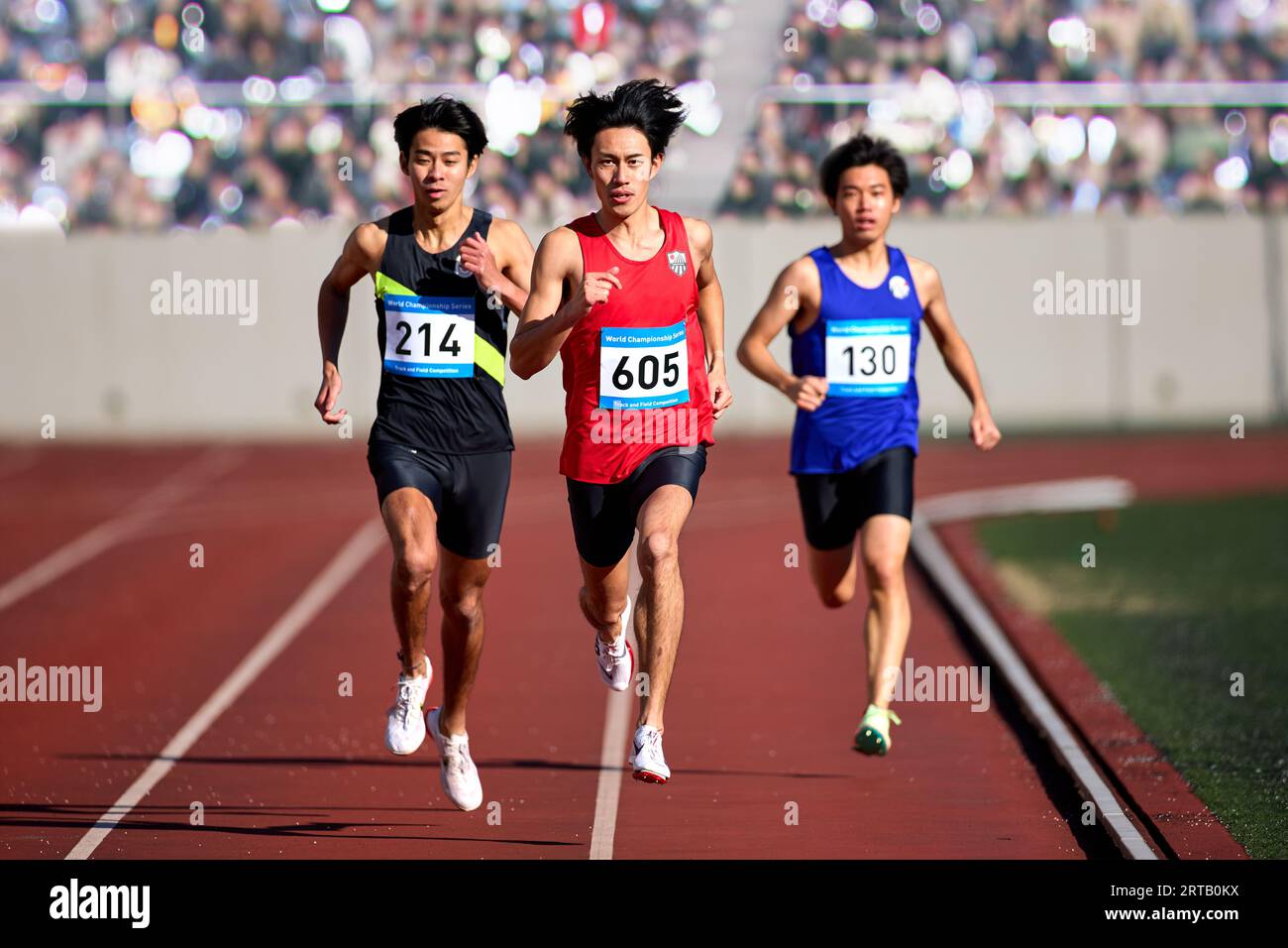 Japanese athletes running on track Stock Photo - Alamy