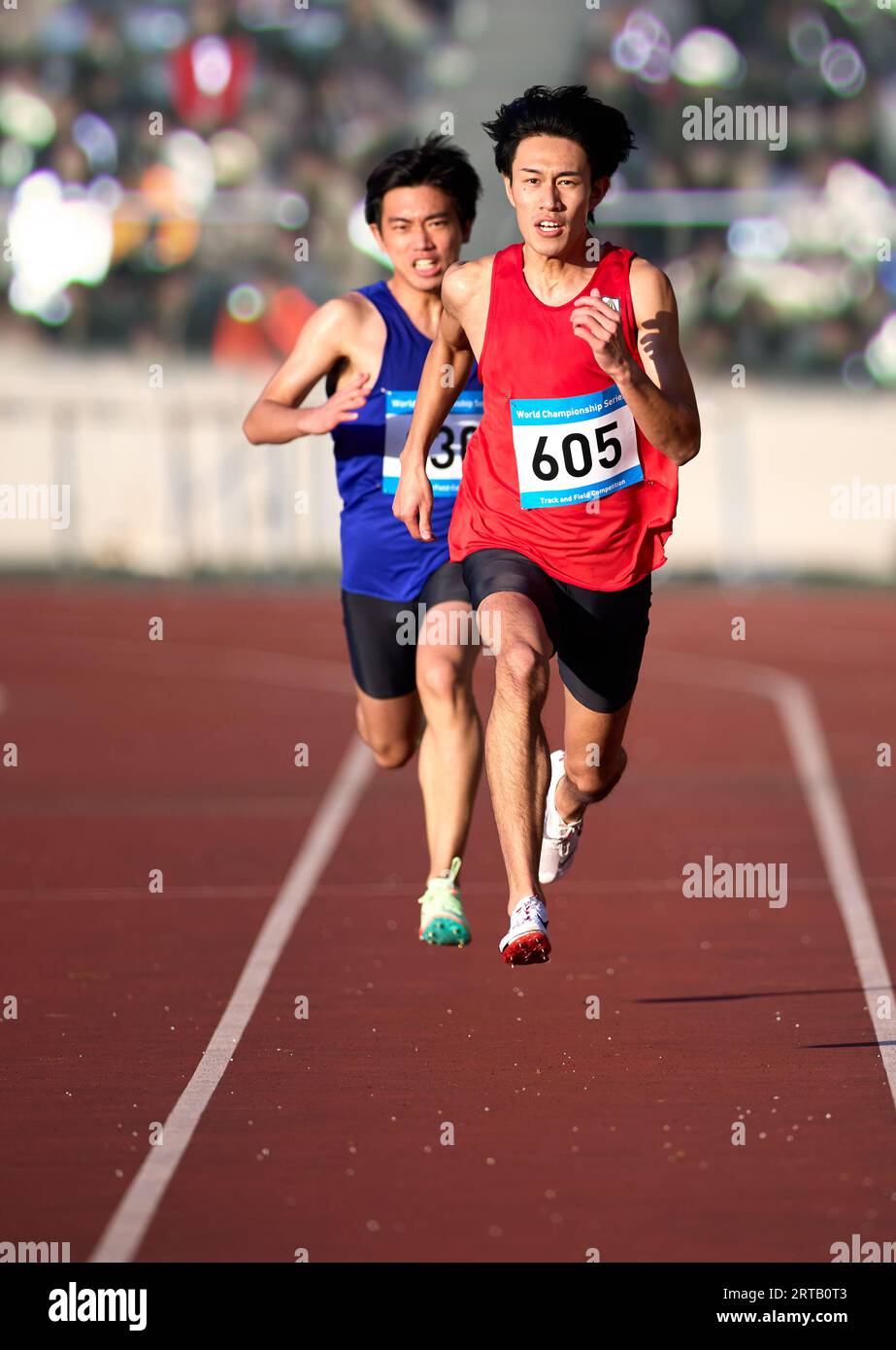 Japanese athletes running on track Stock Photo - Alamy