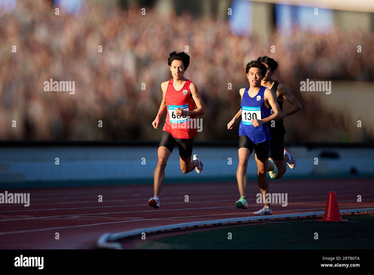 Japanese athletes running on track Stock Photo - Alamy