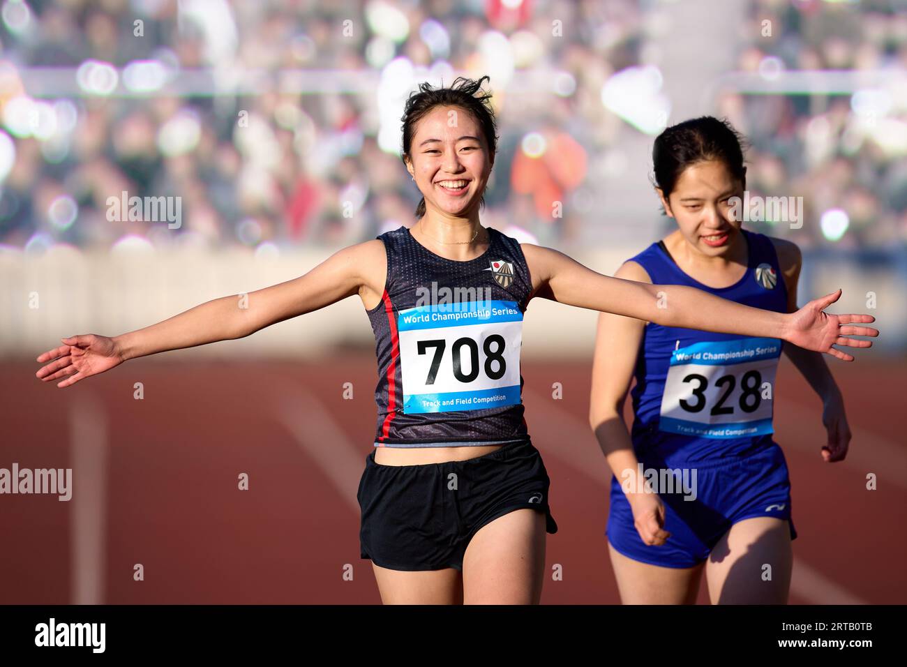 Japanese athletes running on track Stock Photo - Alamy