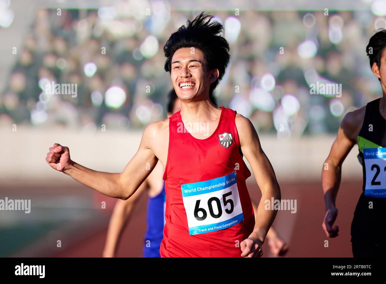 Japanese athletes running on track Stock Photo - Alamy