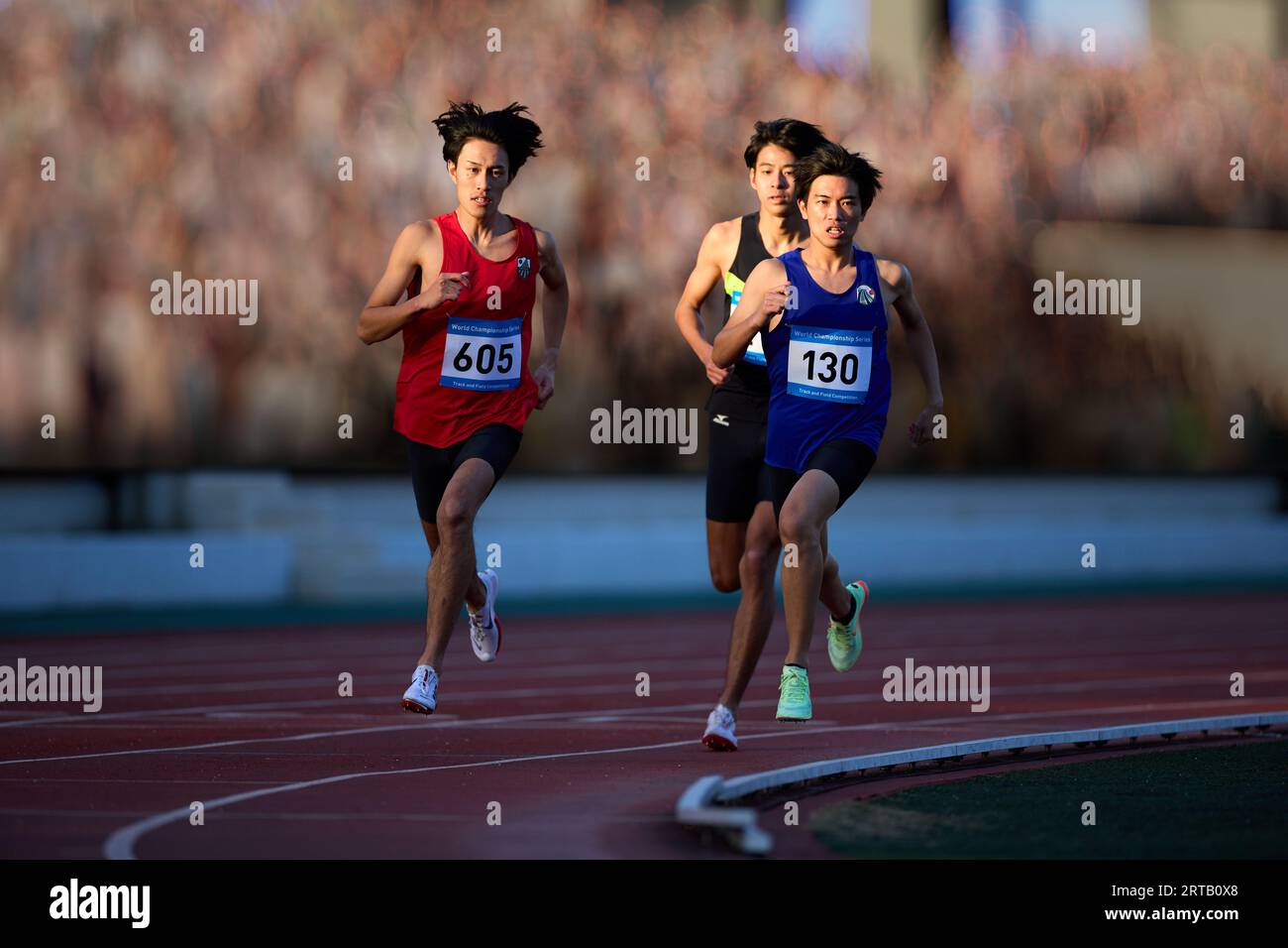 Japanese athletes running on track Stock Photo - Alamy