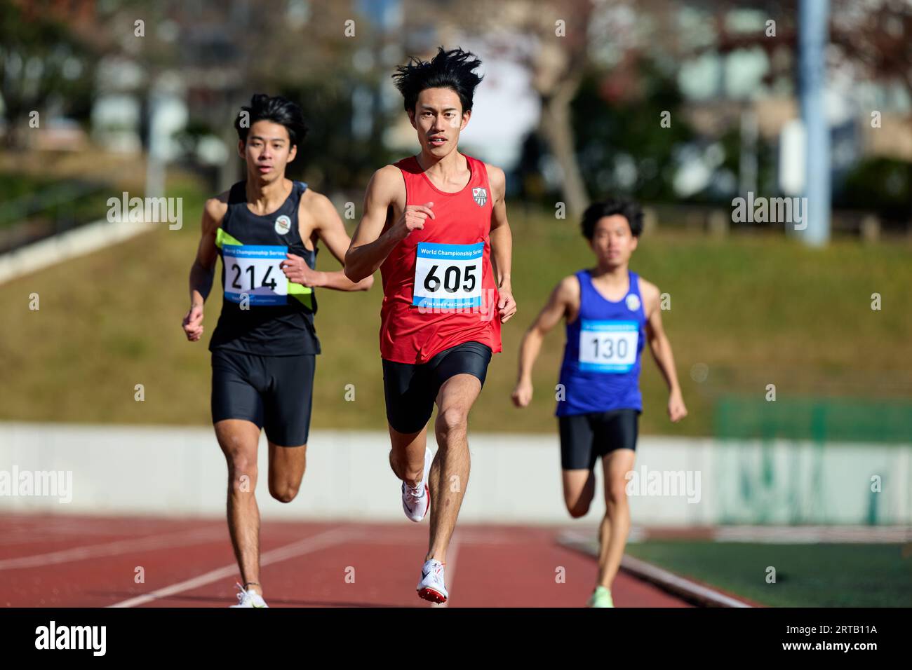 Japanese athletes running on track Stock Photo - Alamy