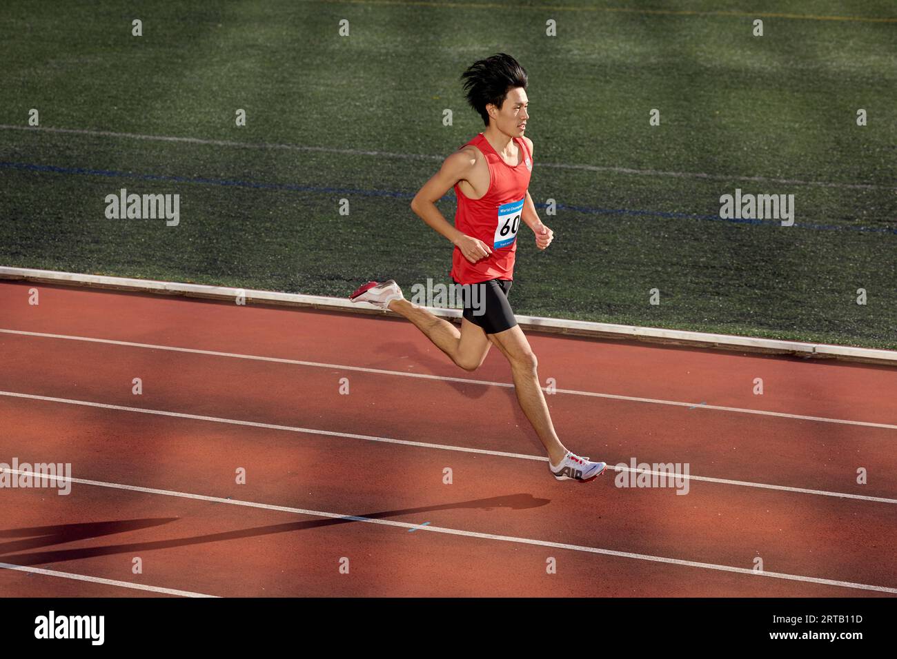 Japanese athlete running on track Stock Photo - Alamy