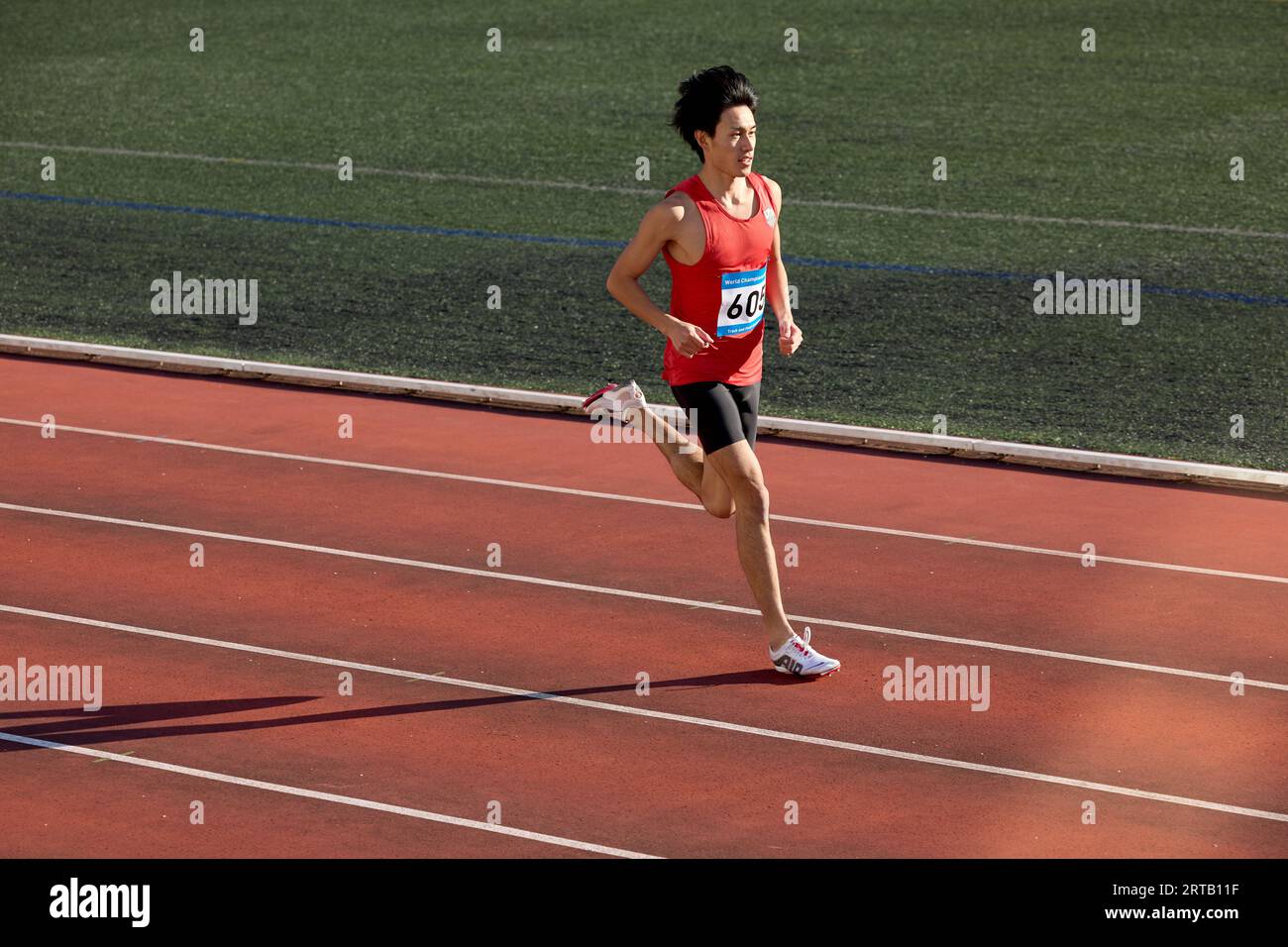 Japanese athlete running on track Stock Photo - Alamy