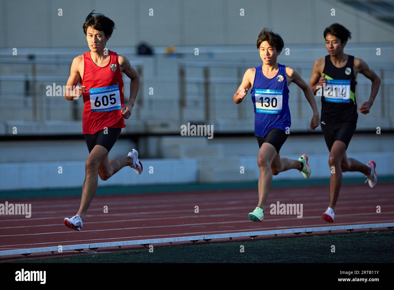 Japanese athletes running on track Stock Photo - Alamy