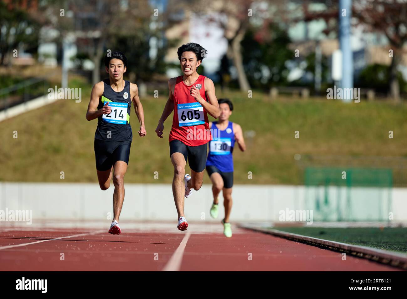 Japanese athletes running on track Stock Photo - Alamy