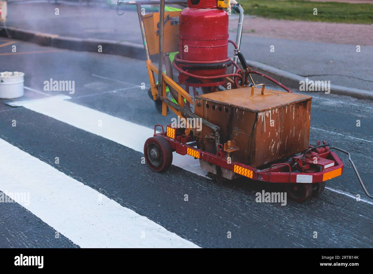 Process of making new road surface markings with a line striping ...
