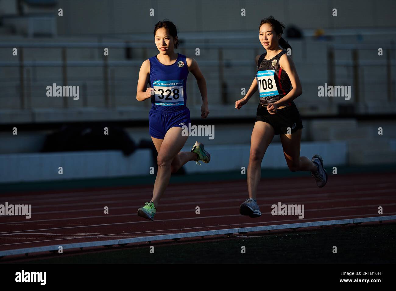 Japanese athletes running on track Stock Photo - Alamy