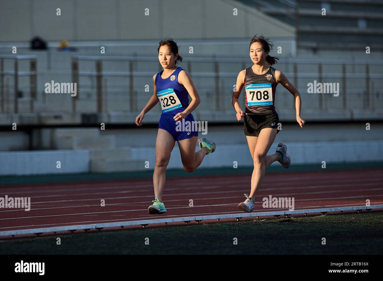 Japanese athletes running on track Stock Photo - Alamy