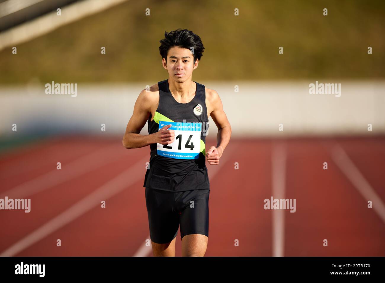 Japanese athlete running on track Stock Photo - Alamy