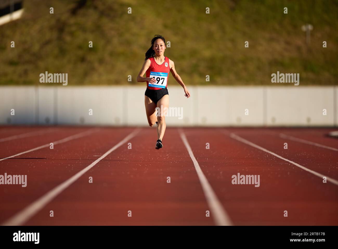 Japanese athlete running on track Stock Photo - Alamy
