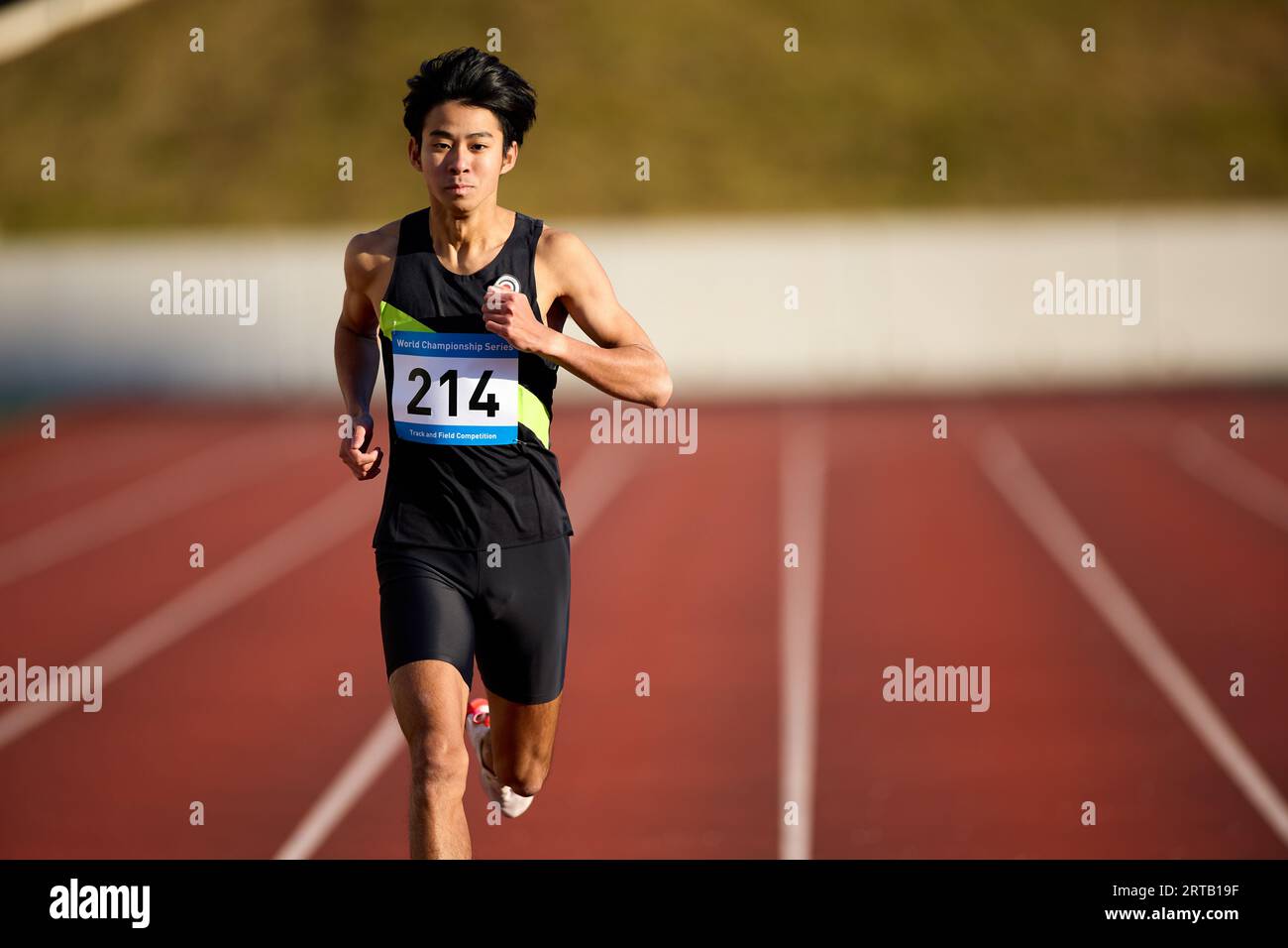 Japanese athlete running on track Stock Photo - Alamy