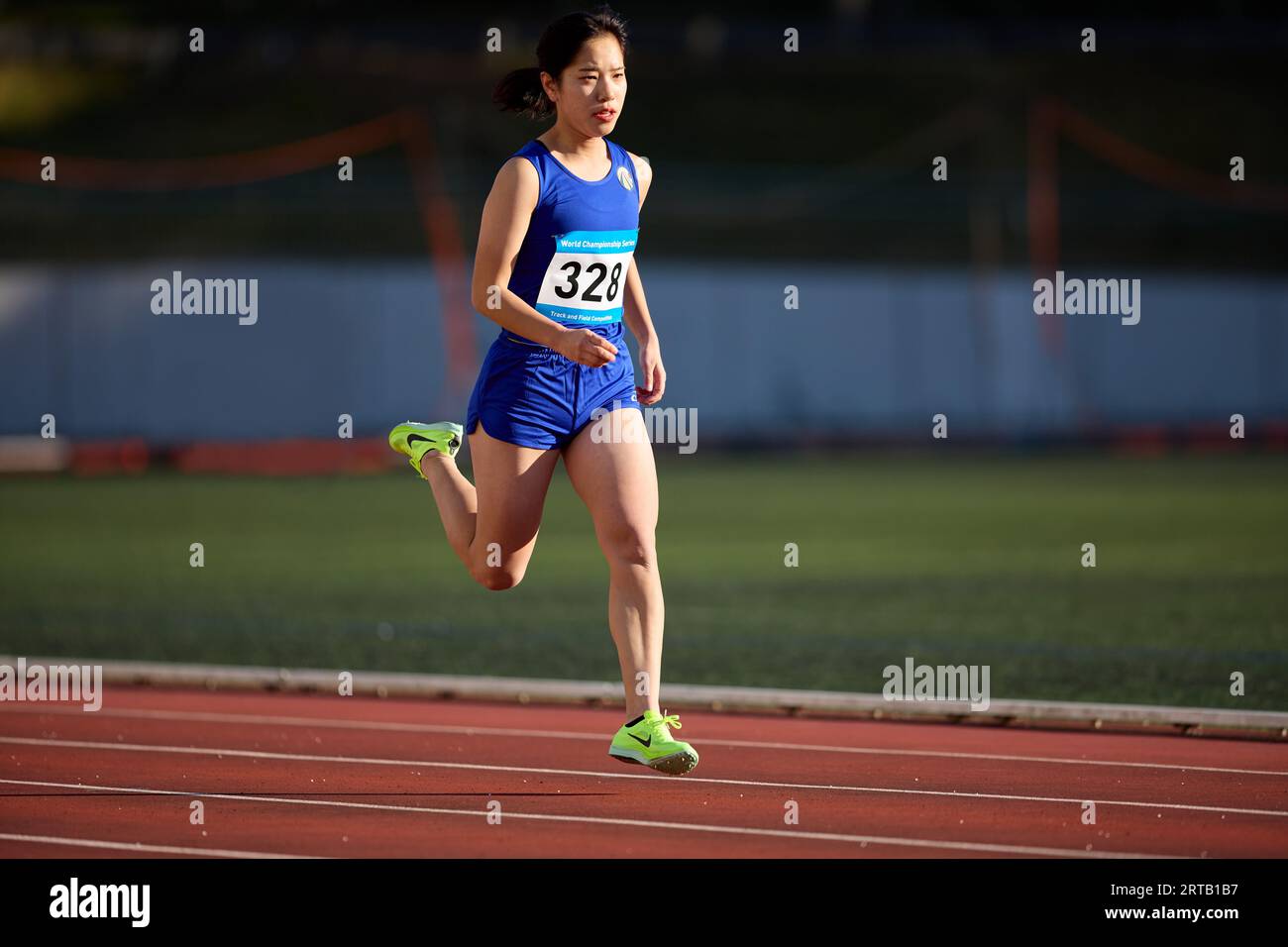 Japanese athlete running on track Stock Photo - Alamy
