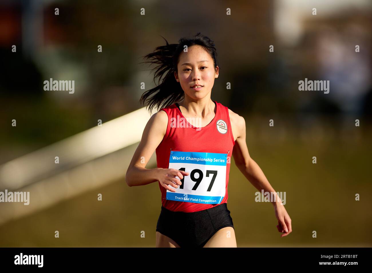 Japanese athlete running on track Stock Photo - Alamy