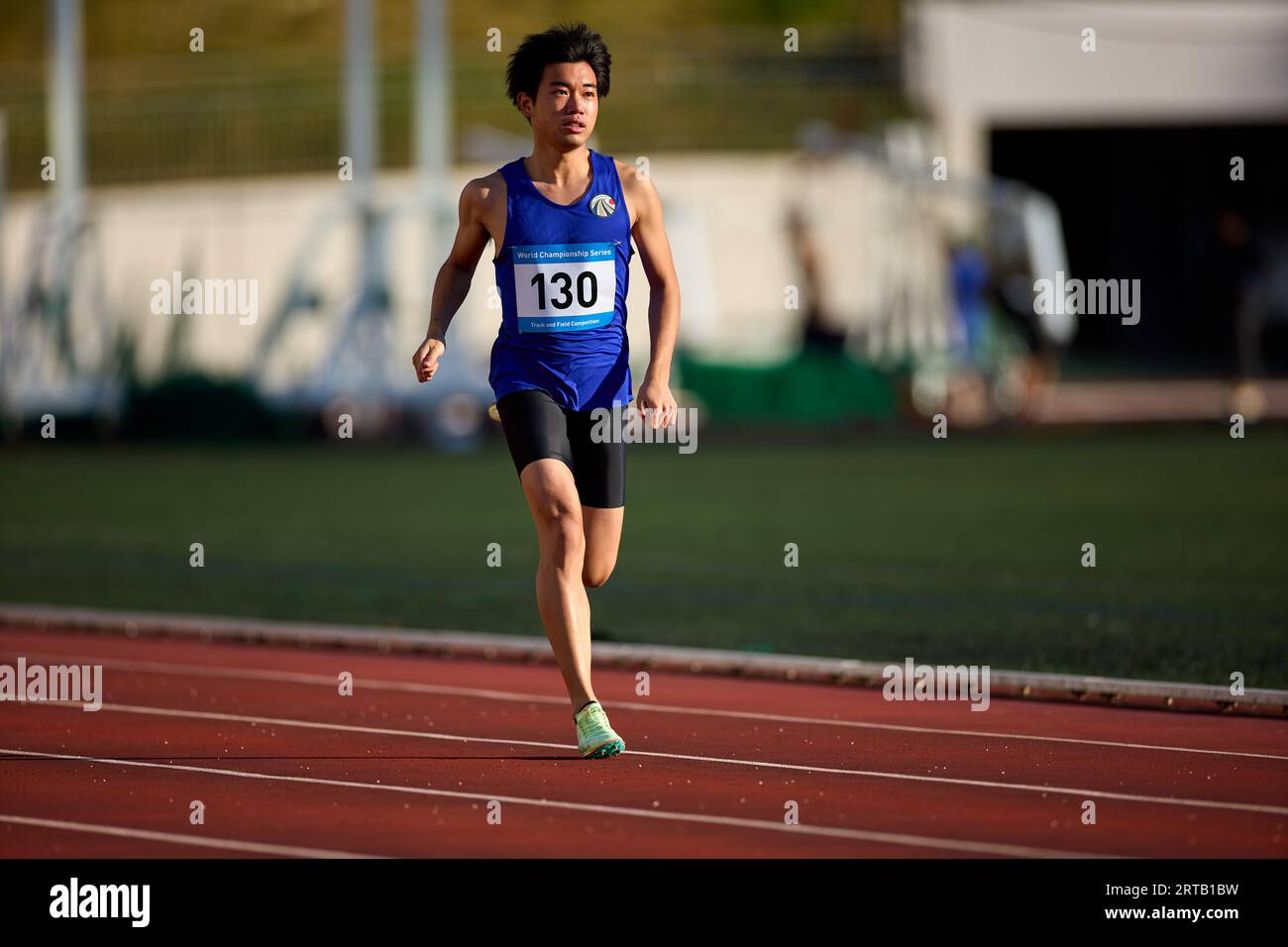 Japanese athlete running on track Stock Photo - Alamy