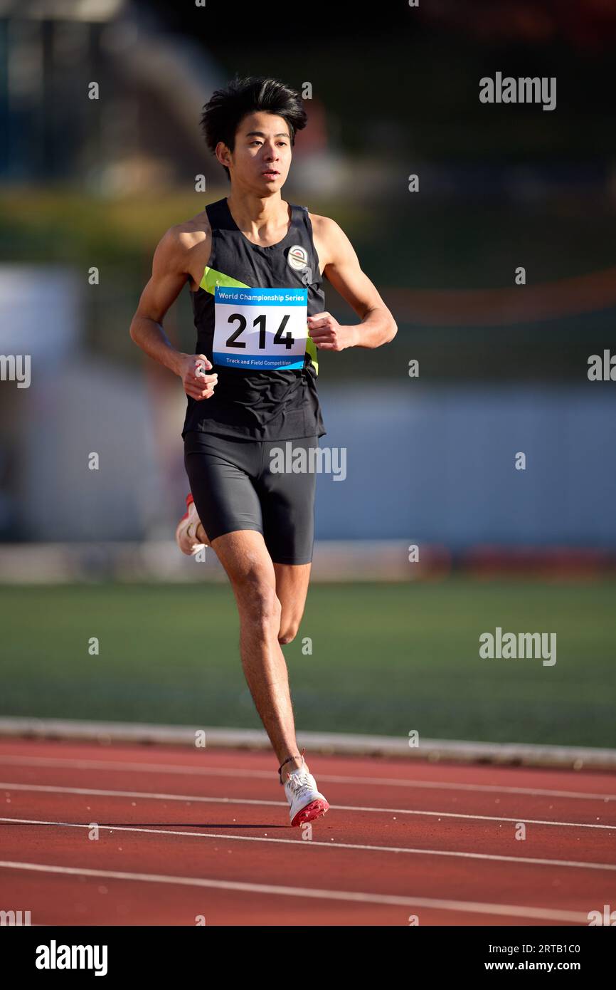Japanese athlete running on track Stock Photo - Alamy