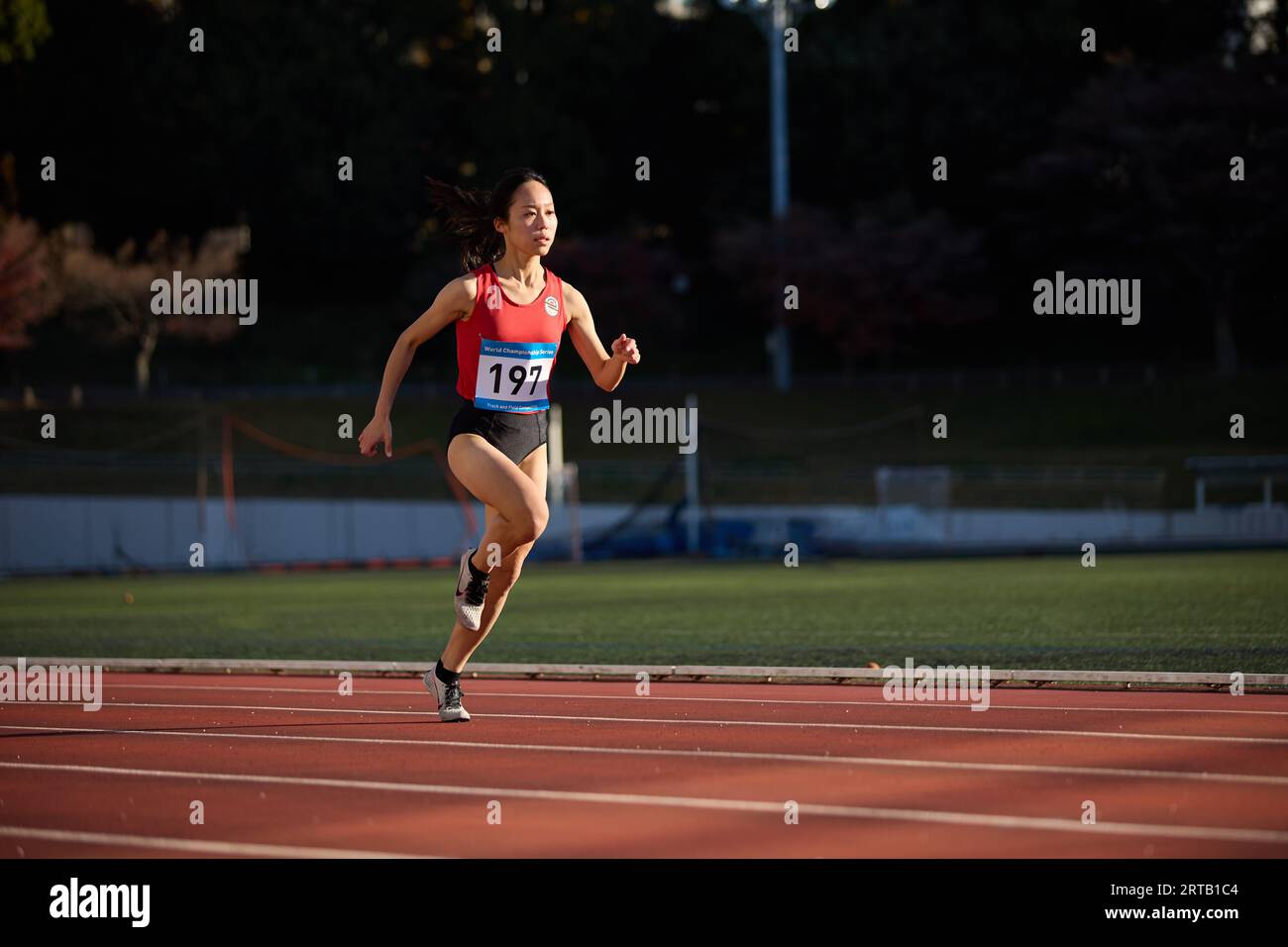 Japanese athlete running on track Stock Photo - Alamy