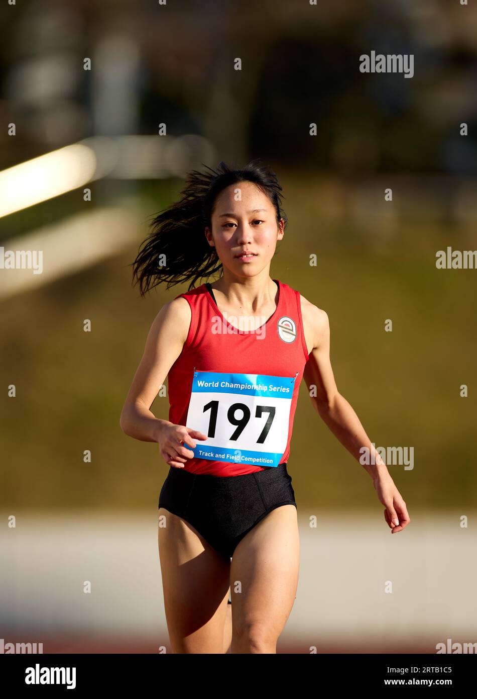 Japanese athlete running on track Stock Photo - Alamy