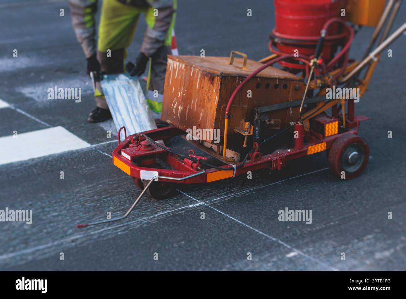 Process of making new road surface markings with a line striping ...