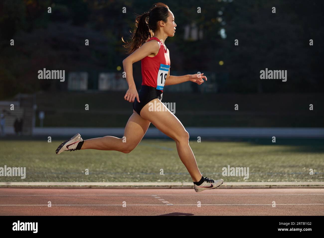 Japanese athlete running on track Stock Photo - Alamy