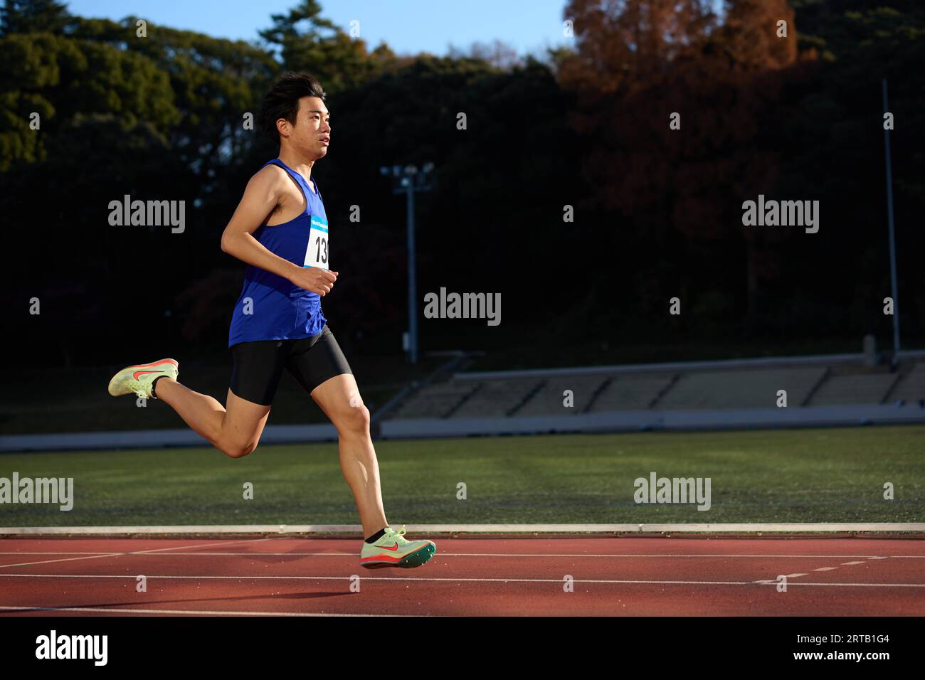 Japanese athlete running on track Stock Photo - Alamy