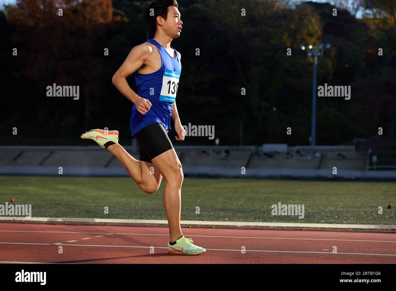 Japanese athlete running on track Stock Photo - Alamy