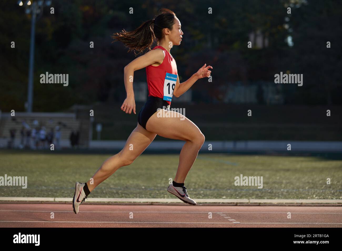 Japanese athlete running on track Stock Photo - Alamy