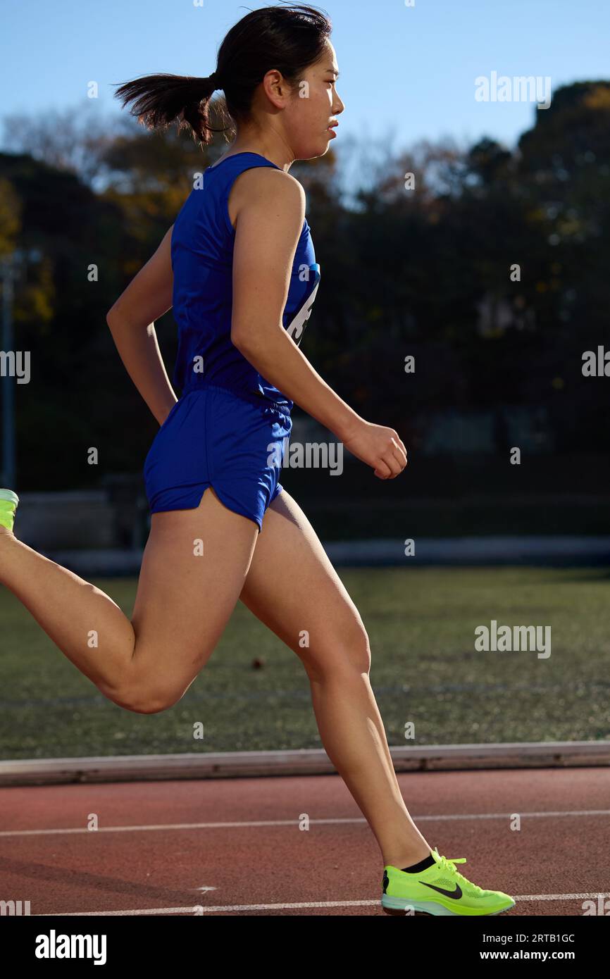 Japanese athlete running on track Stock Photo - Alamy