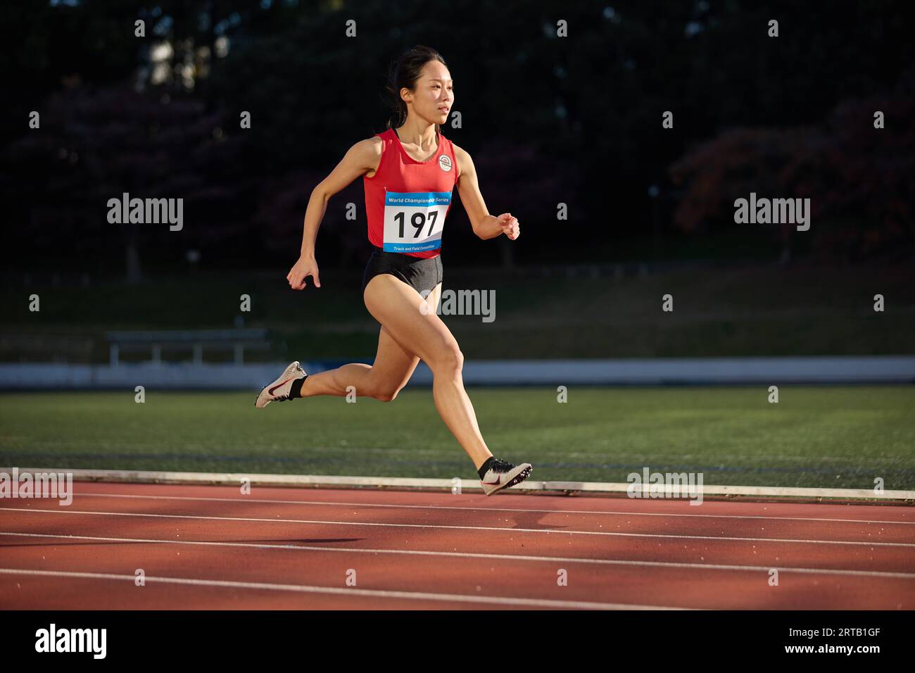 Japanese athlete running on track Stock Photo - Alamy