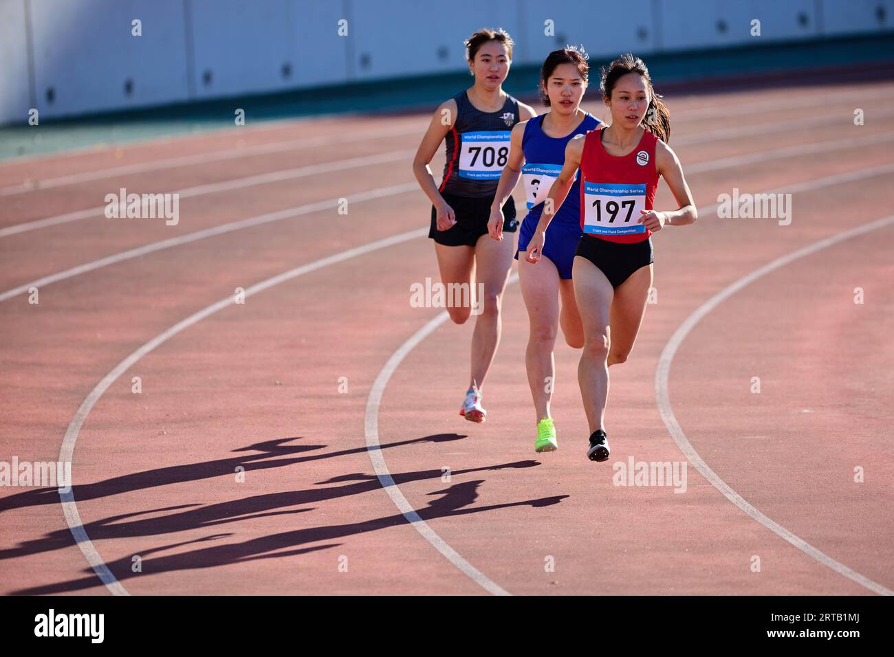 Japanese athletes running on track Stock Photo - Alamy