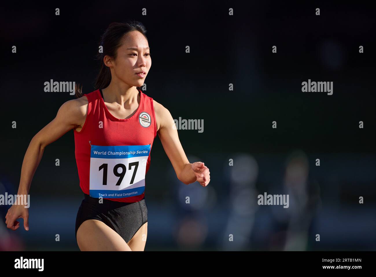 Japanese athlete running on track Stock Photo - Alamy