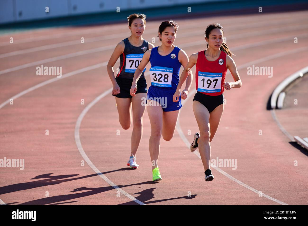 Japanese athletes running on track Stock Photo - Alamy