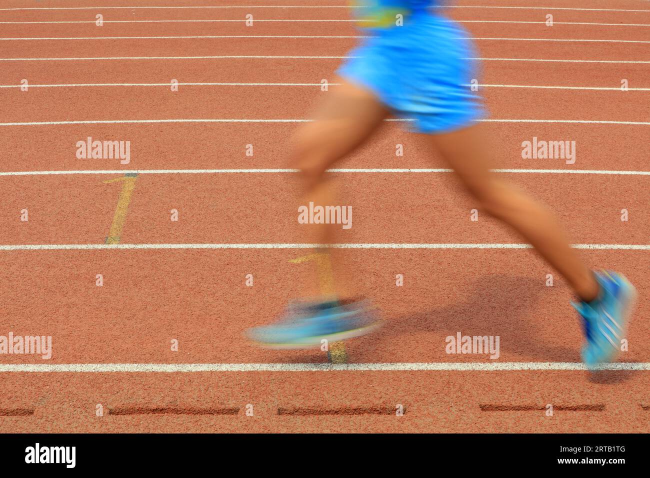 Long distance runners are running on the track Stock Photo - Alamy