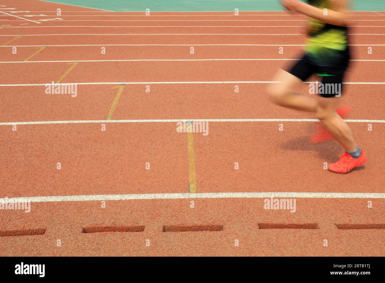 Long distance runners are running on the track Stock Photo - Alamy