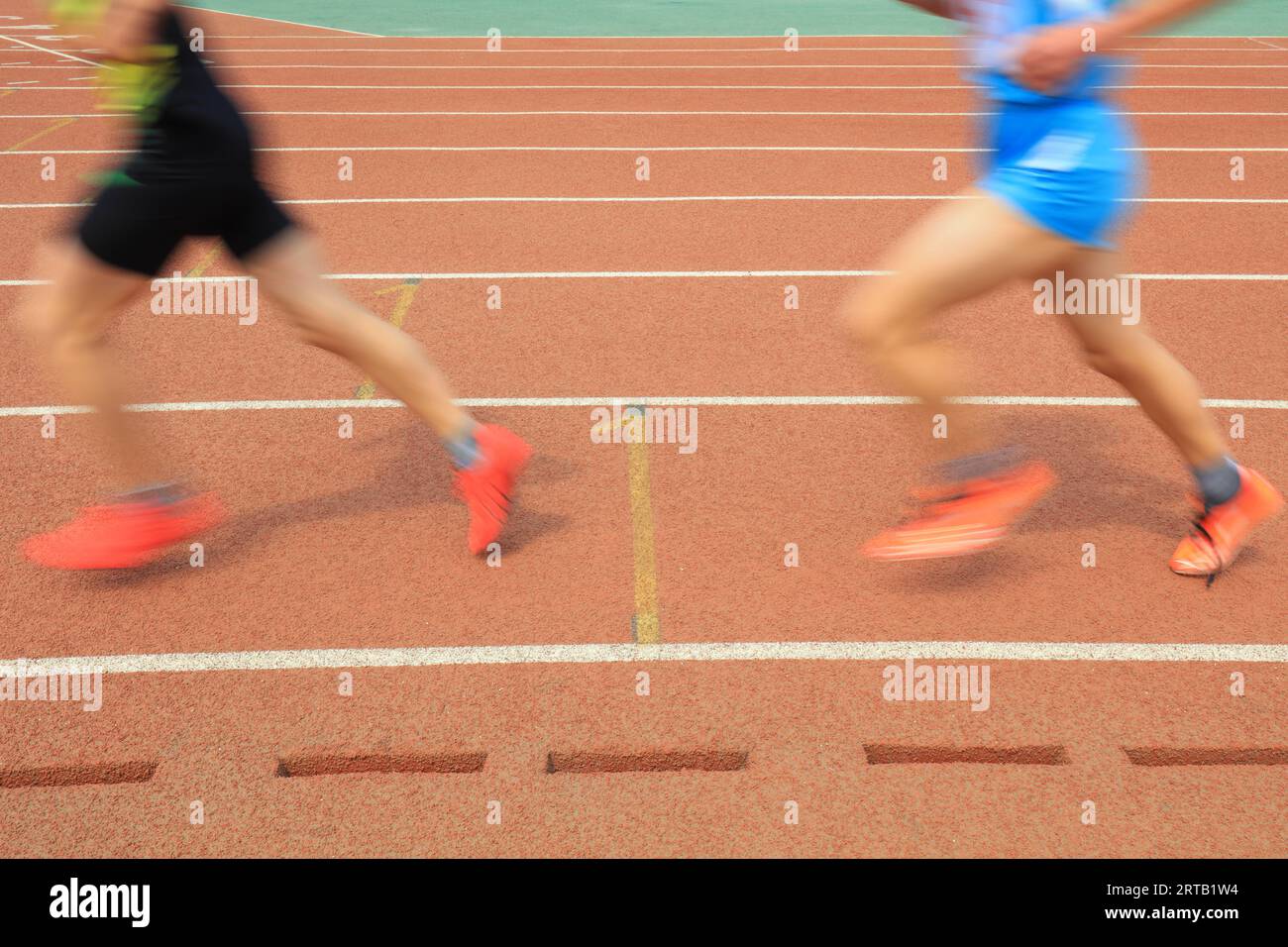 Long distance runners are running on the track Stock Photo - Alamy