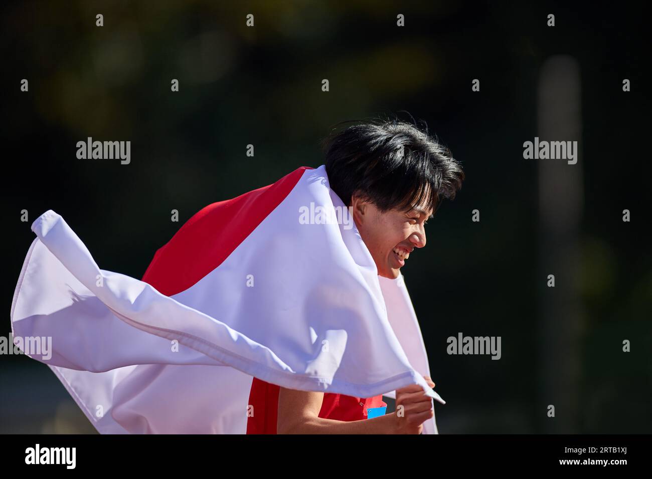 Japanese athlete running on track Stock Photo - Alamy