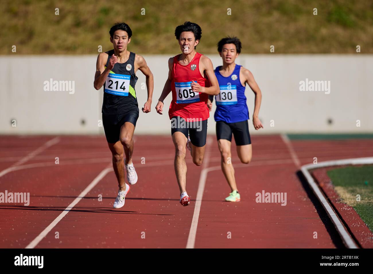 Japanese athletes running on track Stock Photo - Alamy